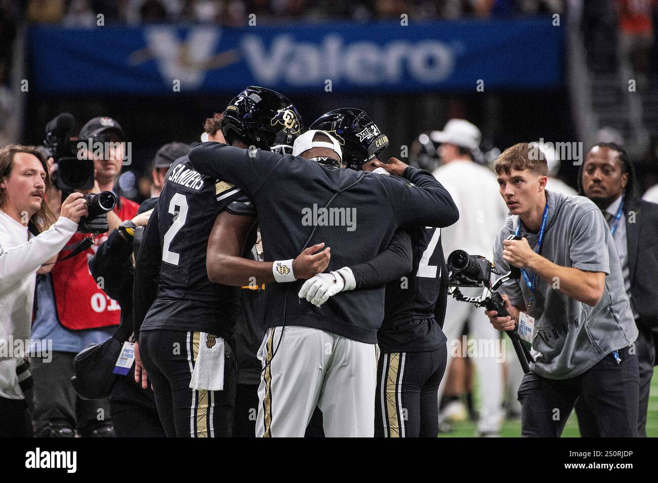 December 28, 2024: University of Colorado head coach Deion Sanders hugs ...