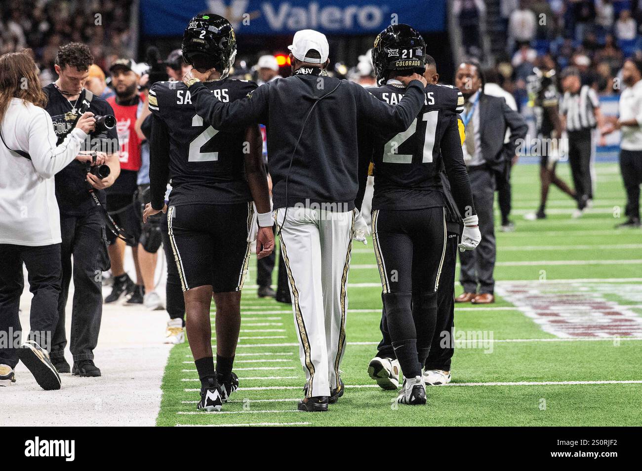 December 28, 2024: University of Colorado head coach Deion Sanders hugs ...