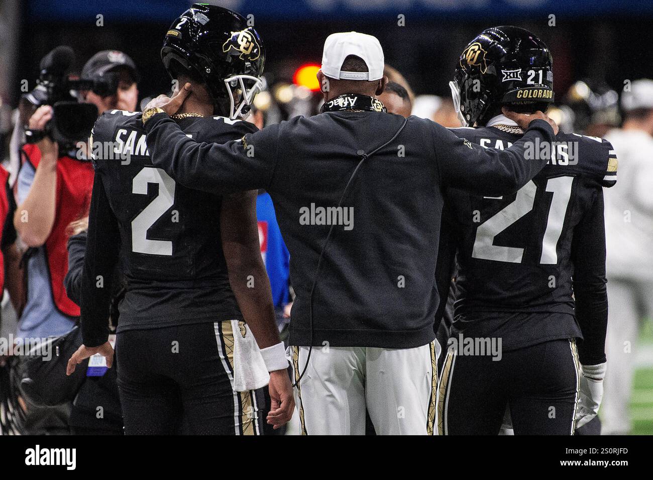 December 28, 2024: University of Colorado head coach Deion Sanders hugs ...