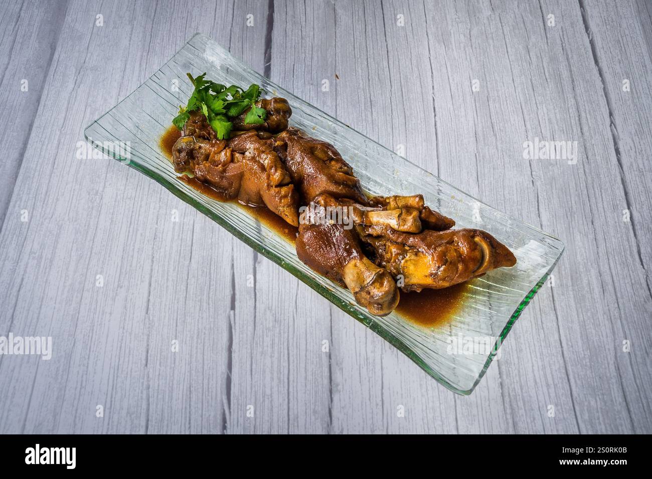 a dish of braised pig trotter chopped and served up Stock Photo - Alamy