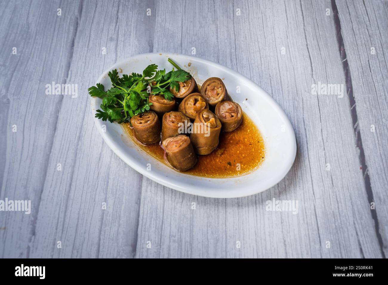 a dish of braised pig swirly intestines chopped and served up Stock ...