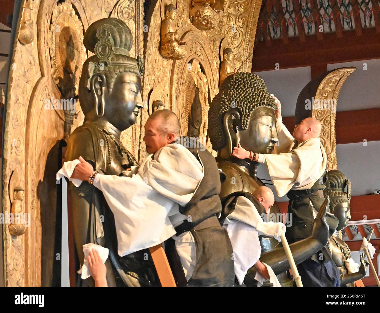 Buddhist monks of Yakushi-ji temple dust off statues of the Buddha at ...