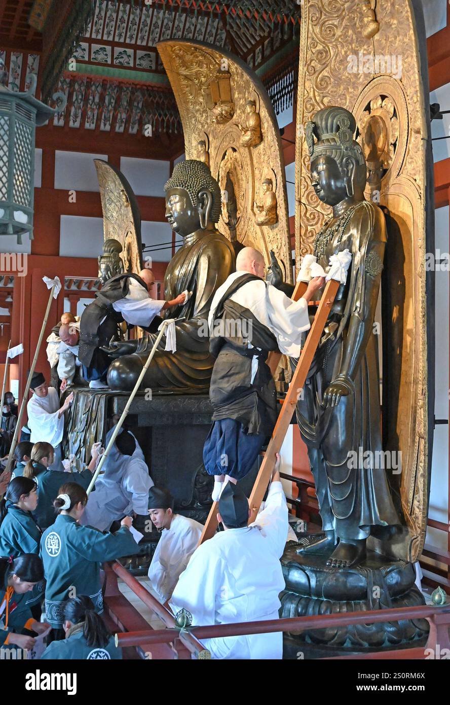 Buddhist monks of Yakushi-ji temple dust off statues of the Buddha at ...