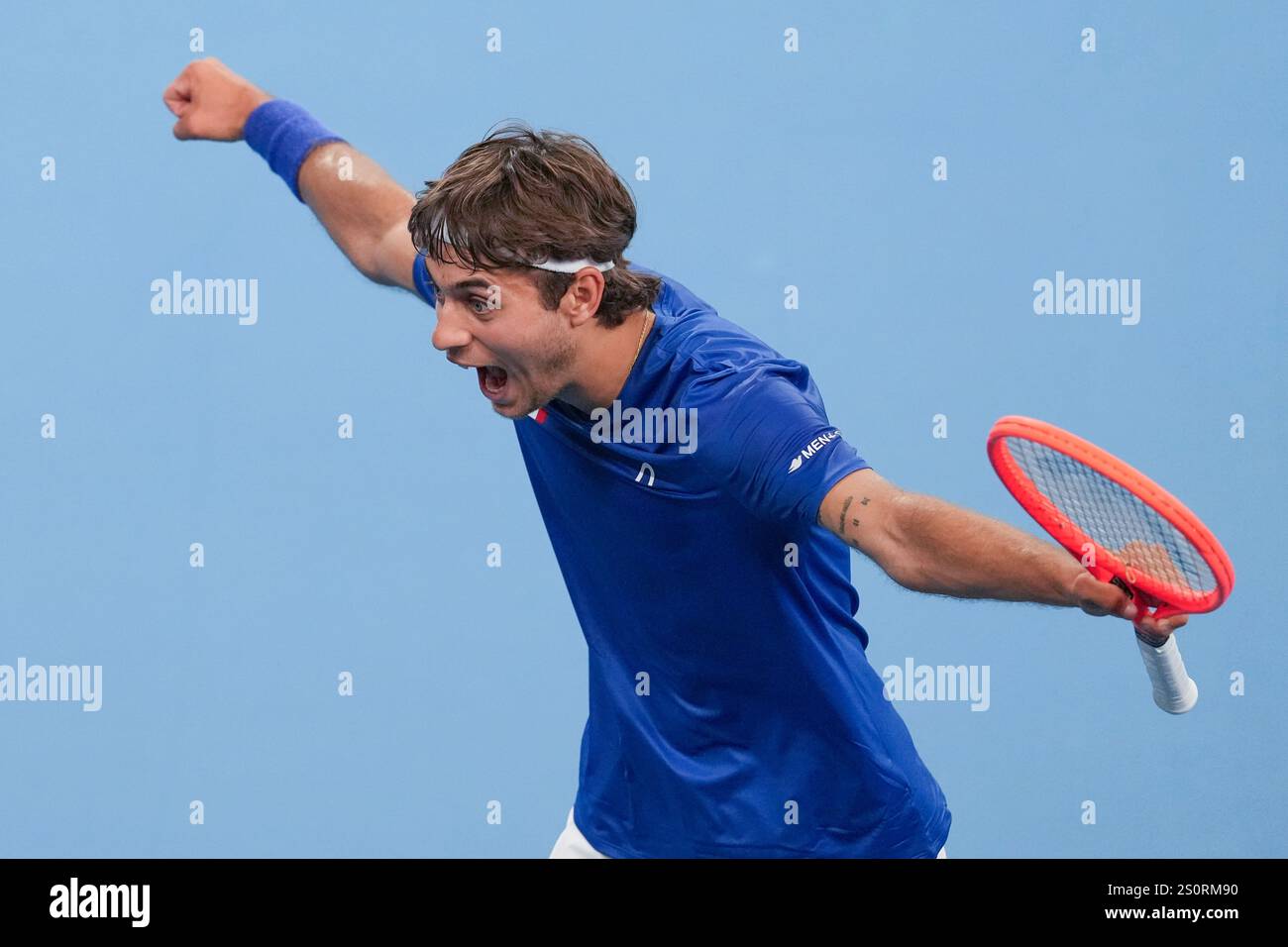 Italy's Flavio Cobolli reacts after defeating Switzerland's Dominic ...