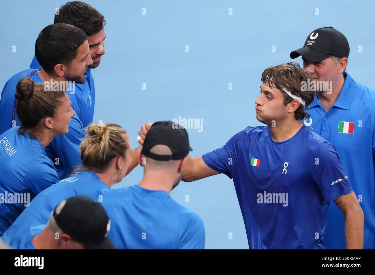Italy's Flavio Cobolli is congratulated by teammates after defeating ...