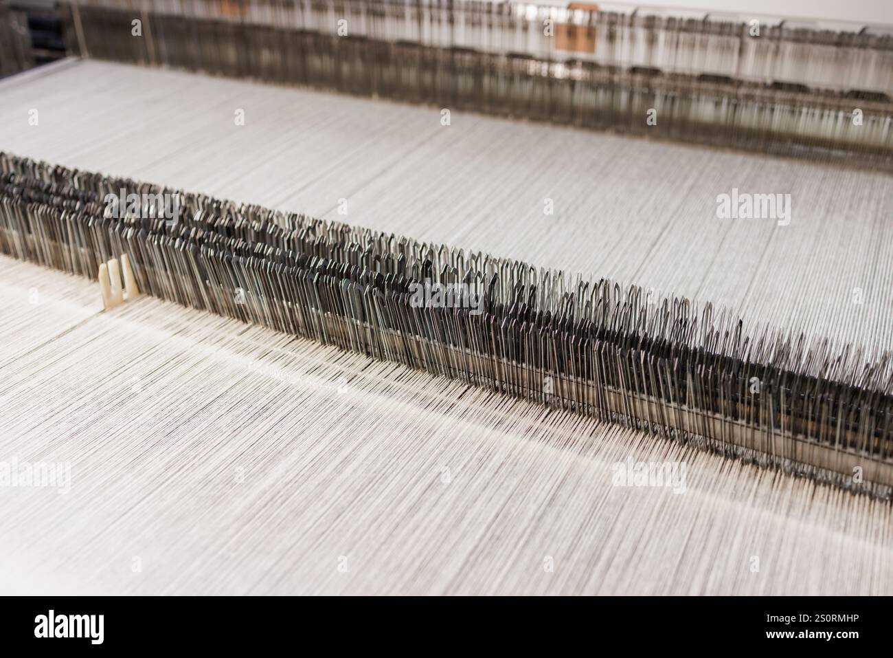 Yarn thread lines on the weaving loom machine. A loom machine for ...