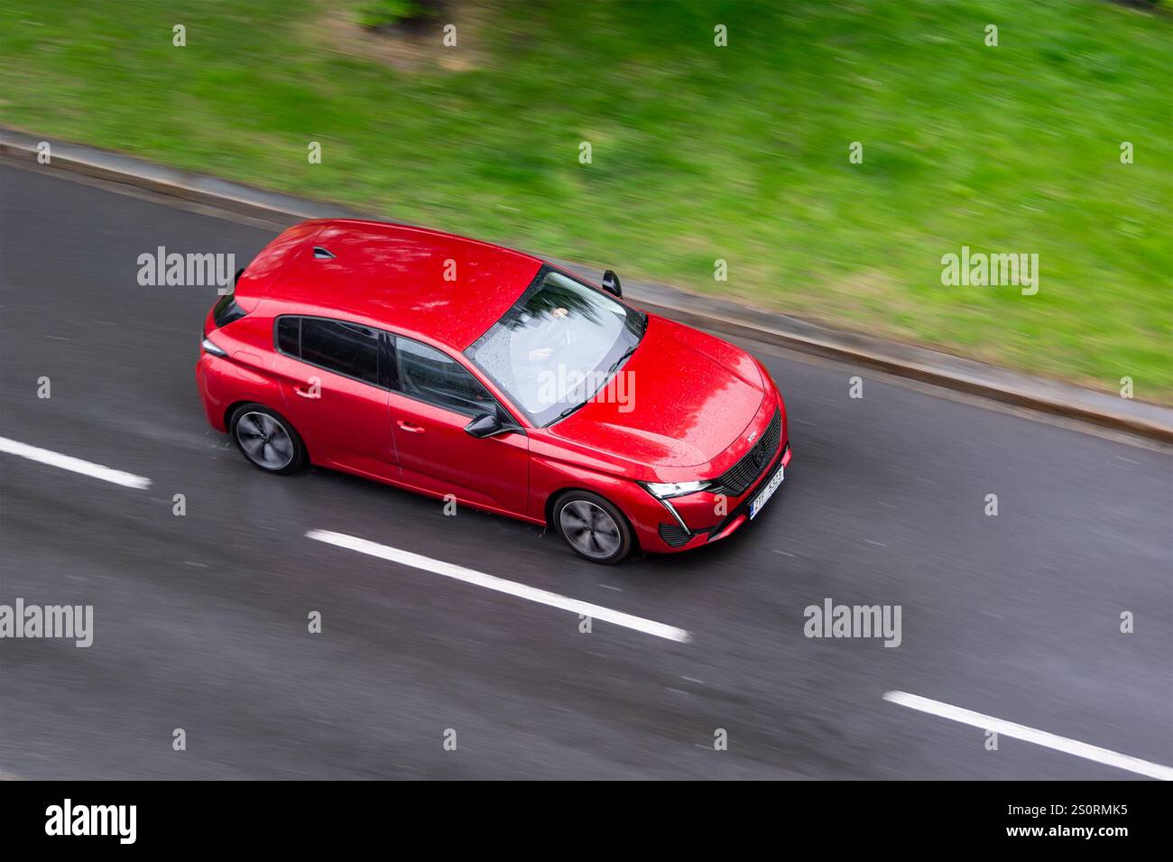 OSTRAVA, CZECHIA - APRIL 24, 2024: Red Peugeot 308 hatchback car with ...