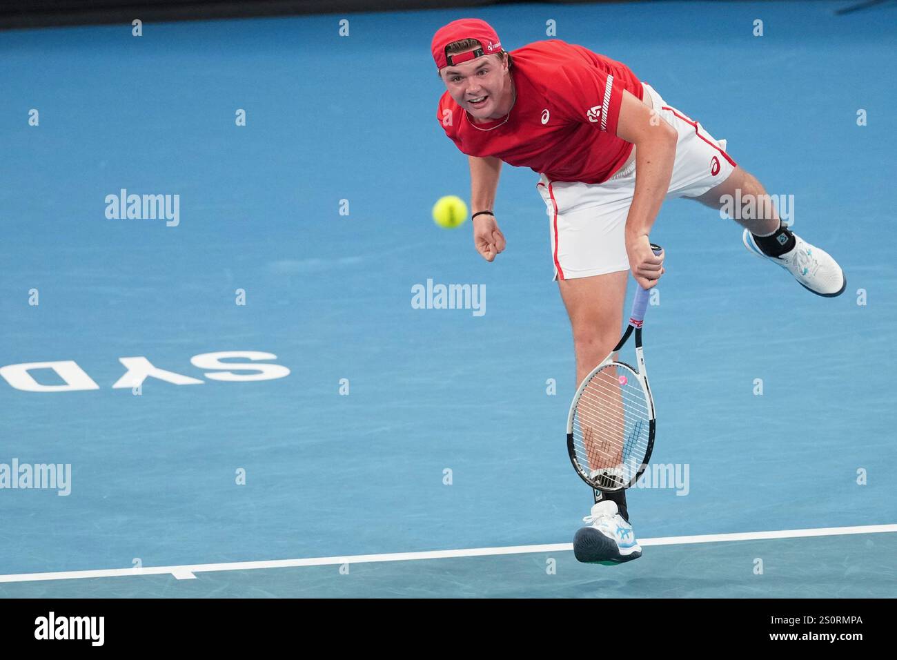 Switzerland's Dominic Stricker serves to Italy's Flavio Cobolli during ...