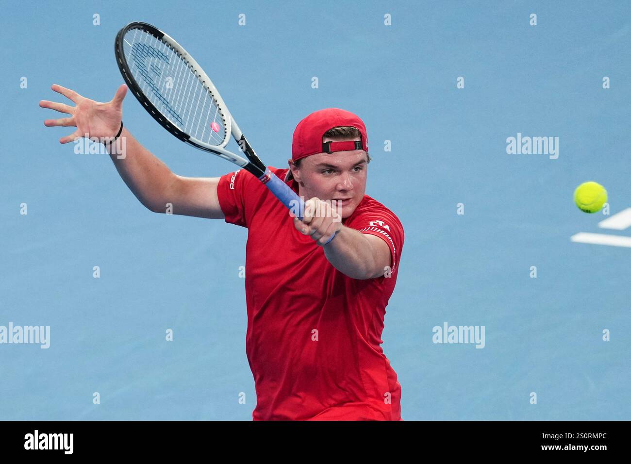 Switzerland's Dominic Stricker plays a backhand return to Italy's ...