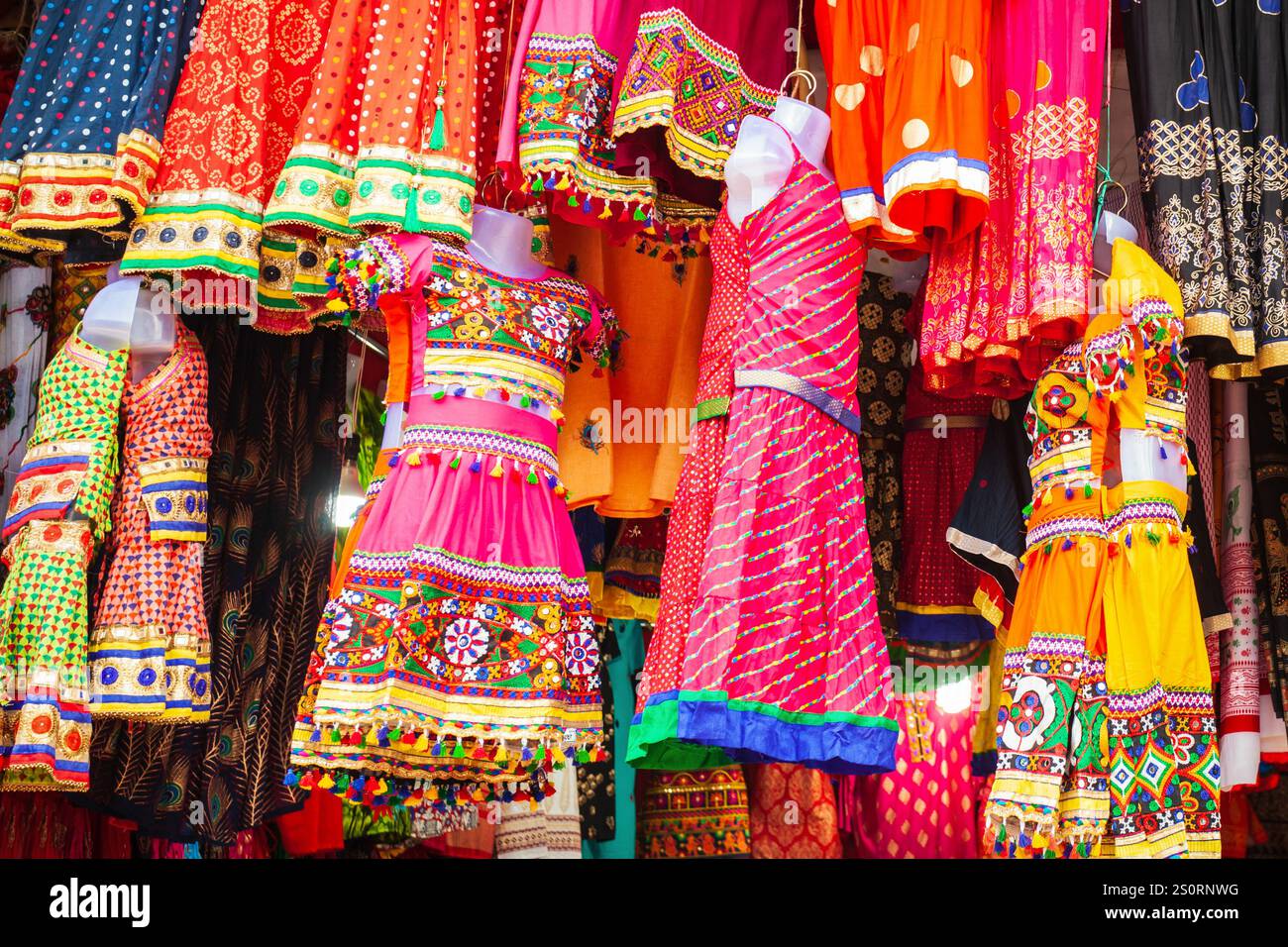 Small shop with indian colorful dresses in Delhi Stock Photo - Alamy