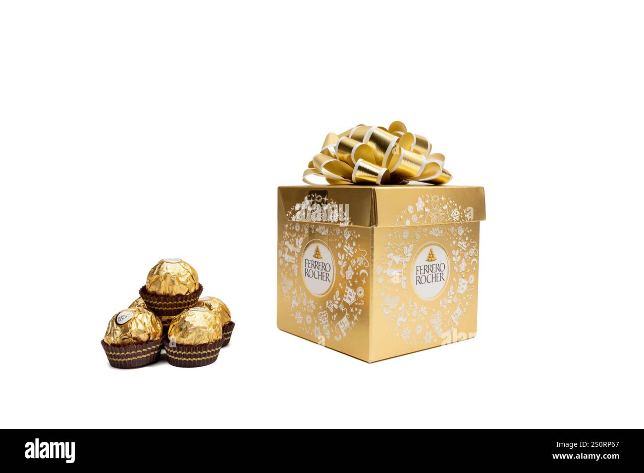 A box of Ferrero Rocher chocolates stands on a white background. The ...