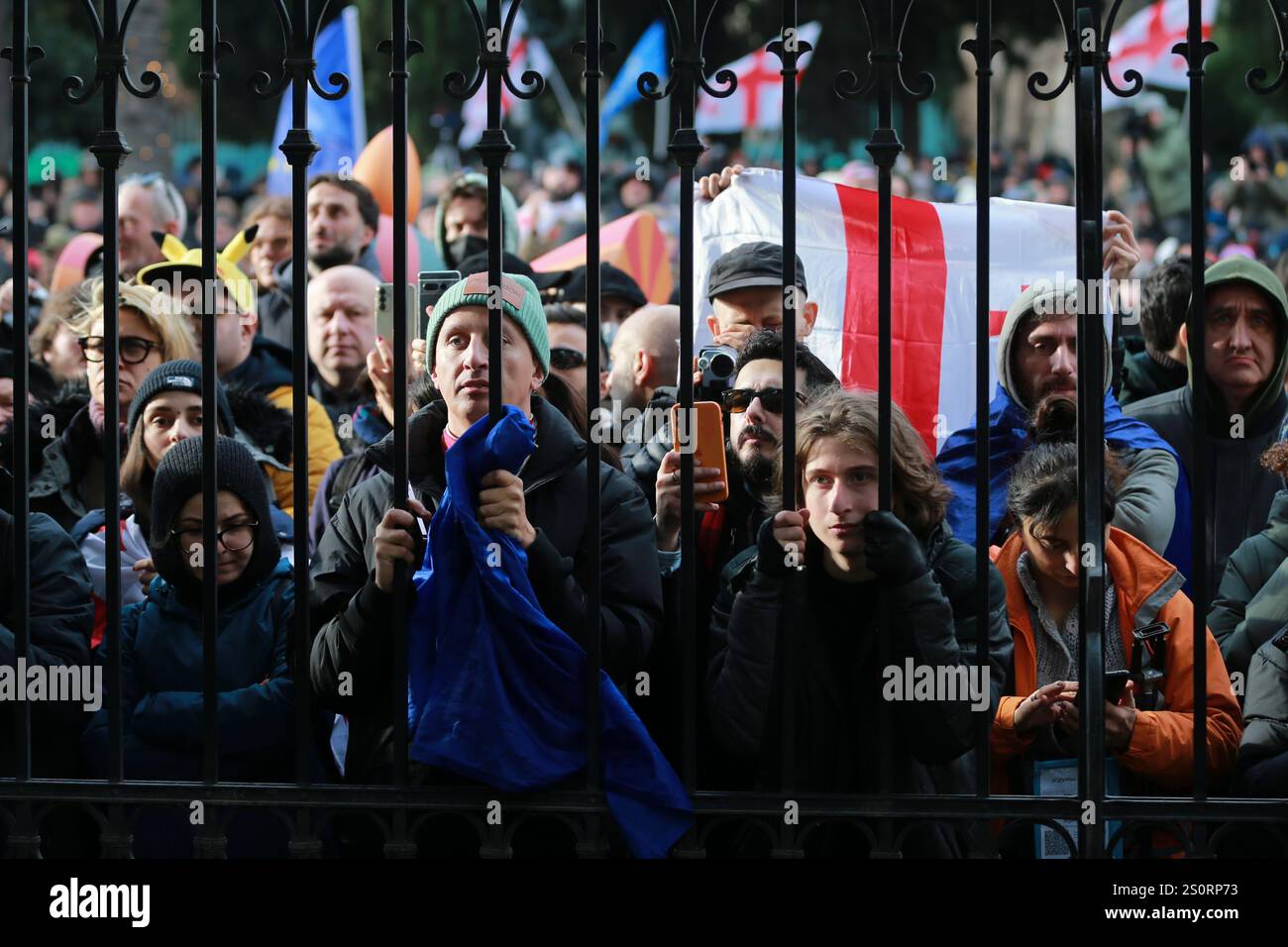 People listen to outgoing Georgian President Salome Zourabichvili ...