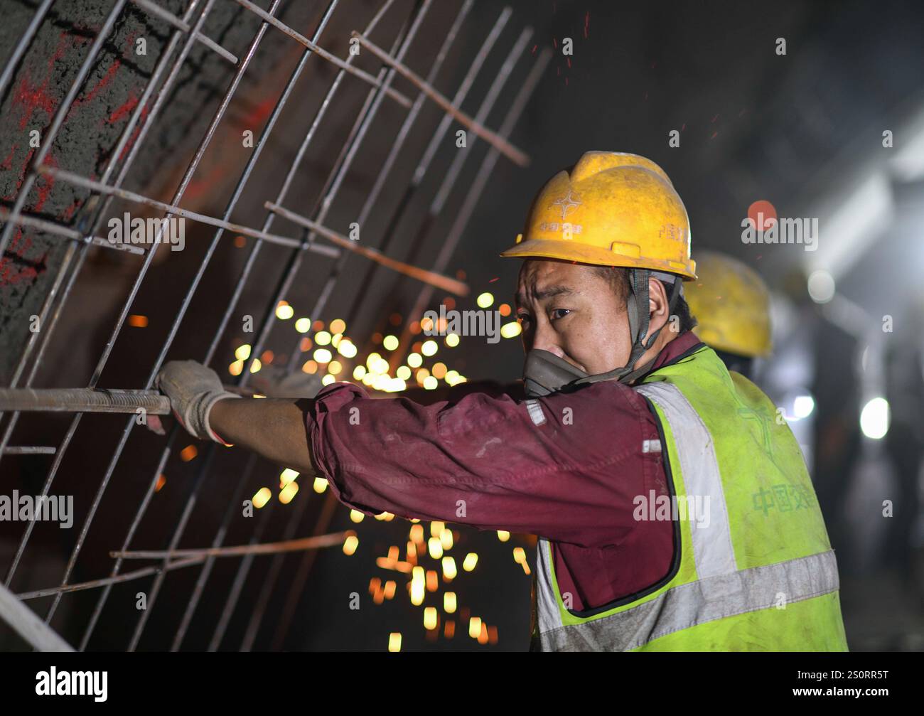 Urumqi. 25th Dec, 2024. Workers operate at the construction site of ...
