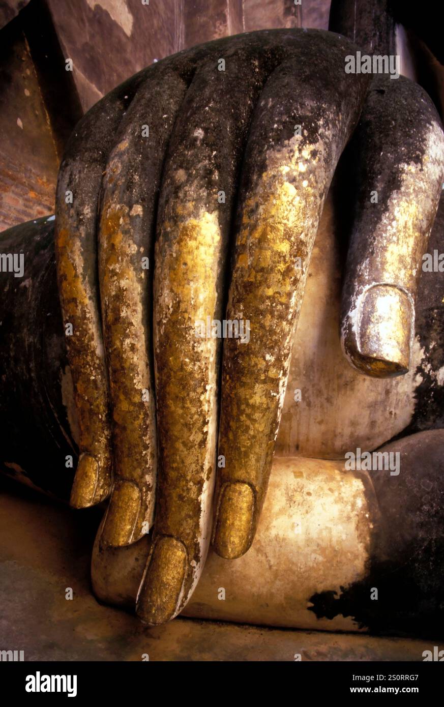 Close-up detail of golden hand mudras covered in gold leaf gilt of a ...