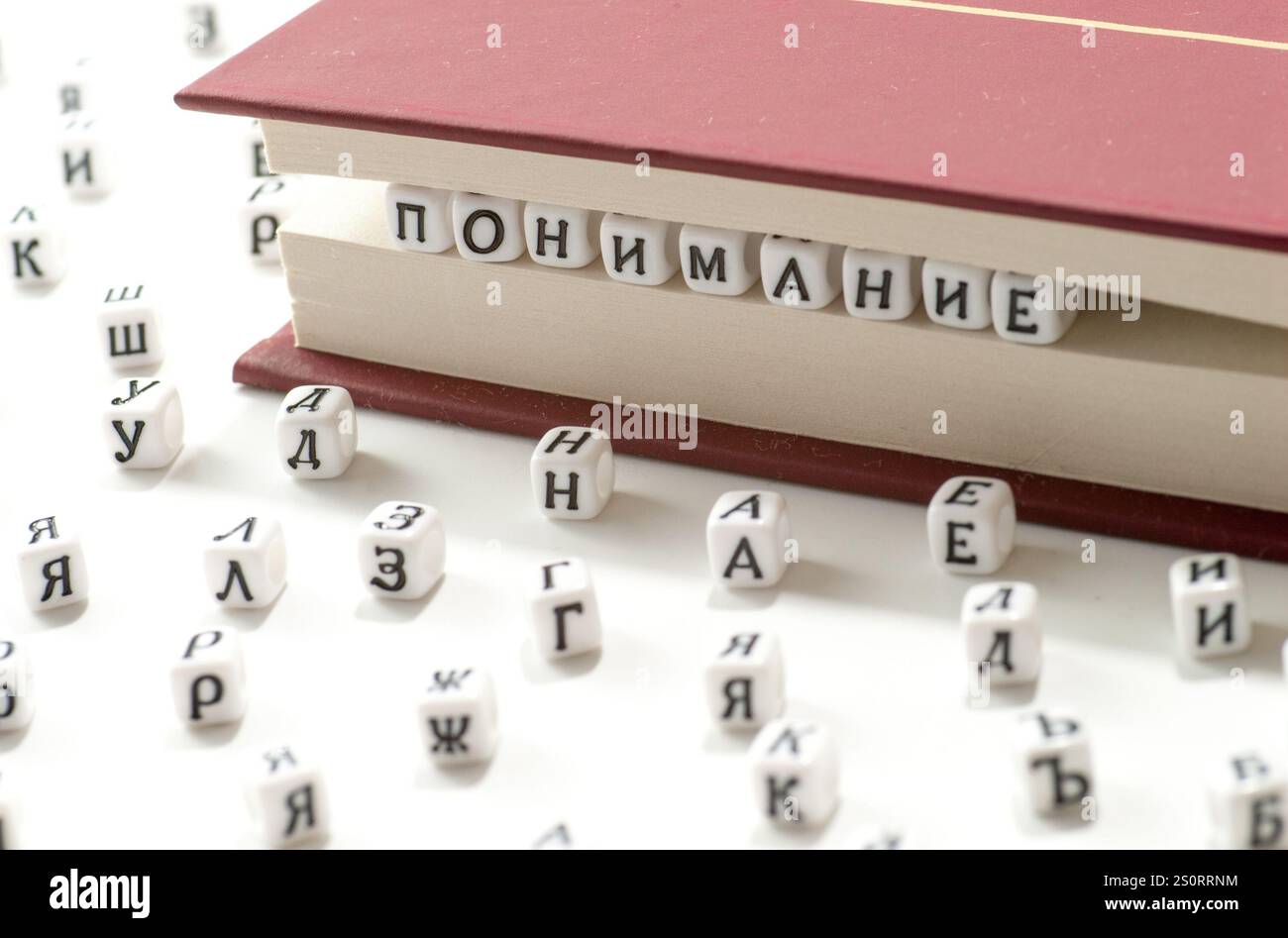 word understanding written win cyrillic letters between book sheets and ...