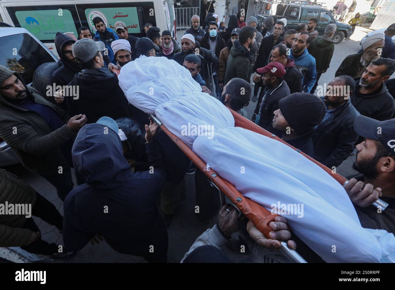 Relatives of the Palestinians died in Israeli attacks, mourn as they ...