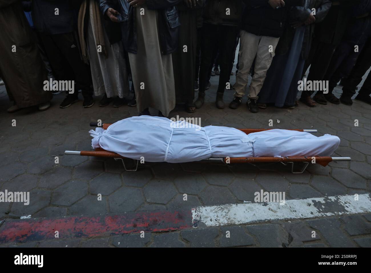 Relatives of the Palestinians died in Israeli attacks, mourn as they ...