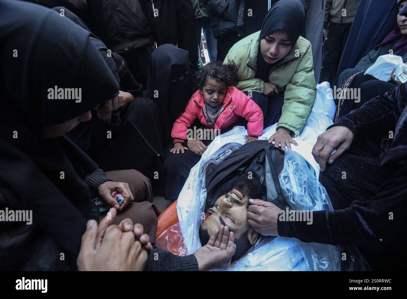 Relatives of the Palestinians died in Israeli attacks, mourn as they ...