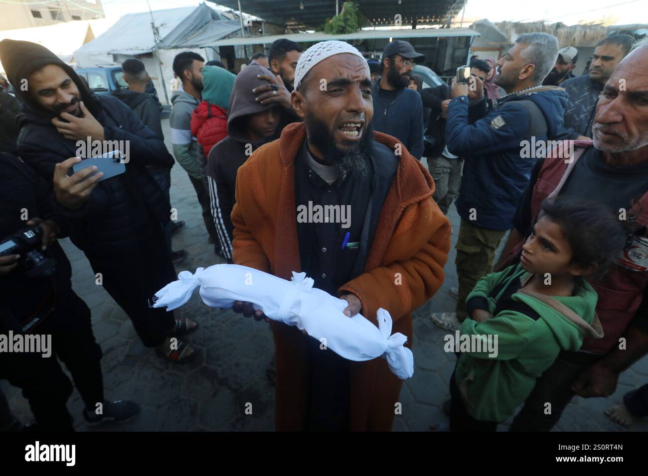 A lifeless body of Palestinian baby, Jomaa Yahya Al-Batran, one month ...