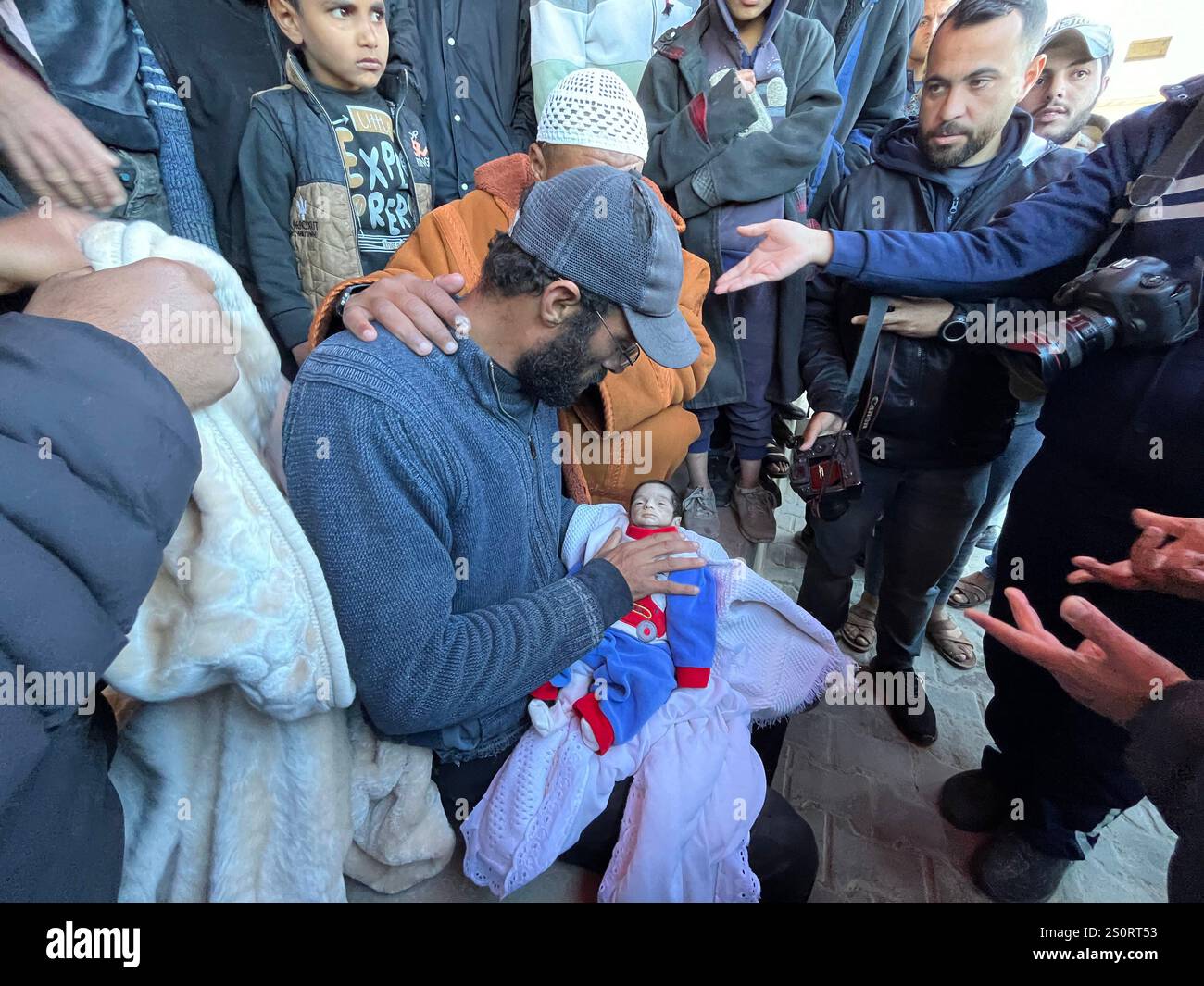 A lifeless body of Palestinian baby, Jomaa Yahya Al-Batran, one month ...
