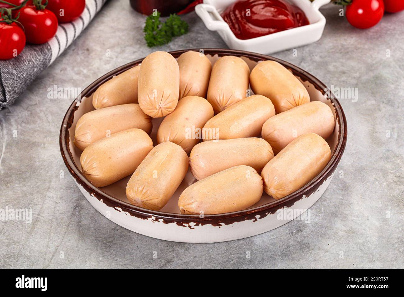Dietary baby mini chicken sausage in the bowl with ketchup Stock Photo ...
