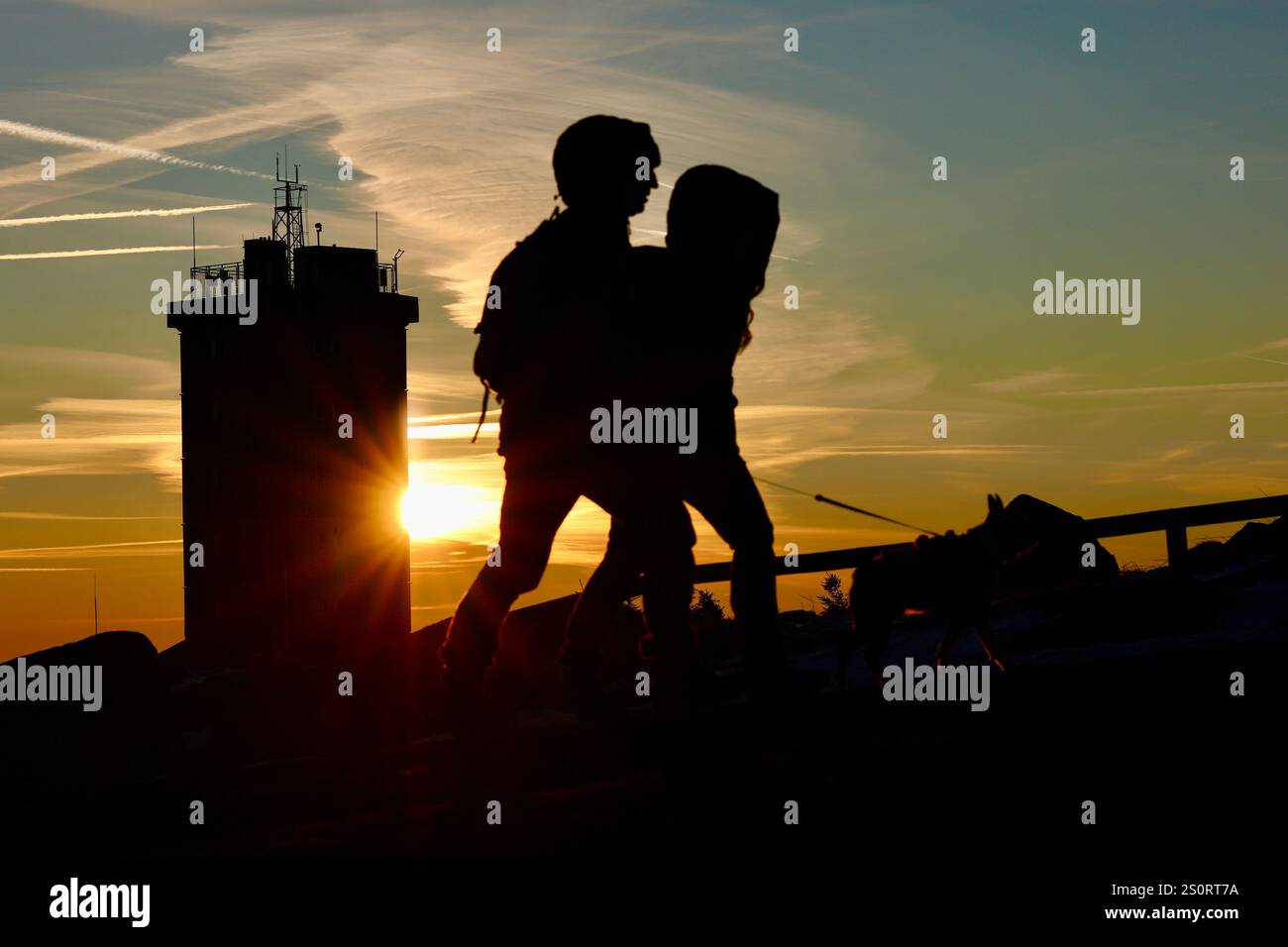 29 December 2024, Saxony-Anhalt, Schierke: Hikers walk on the Brocken ...