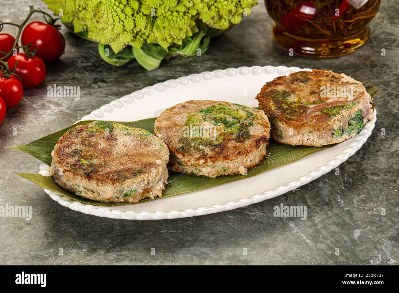 Roasted tuna medallion with broccoli cabbage Stock Photo - Alamy