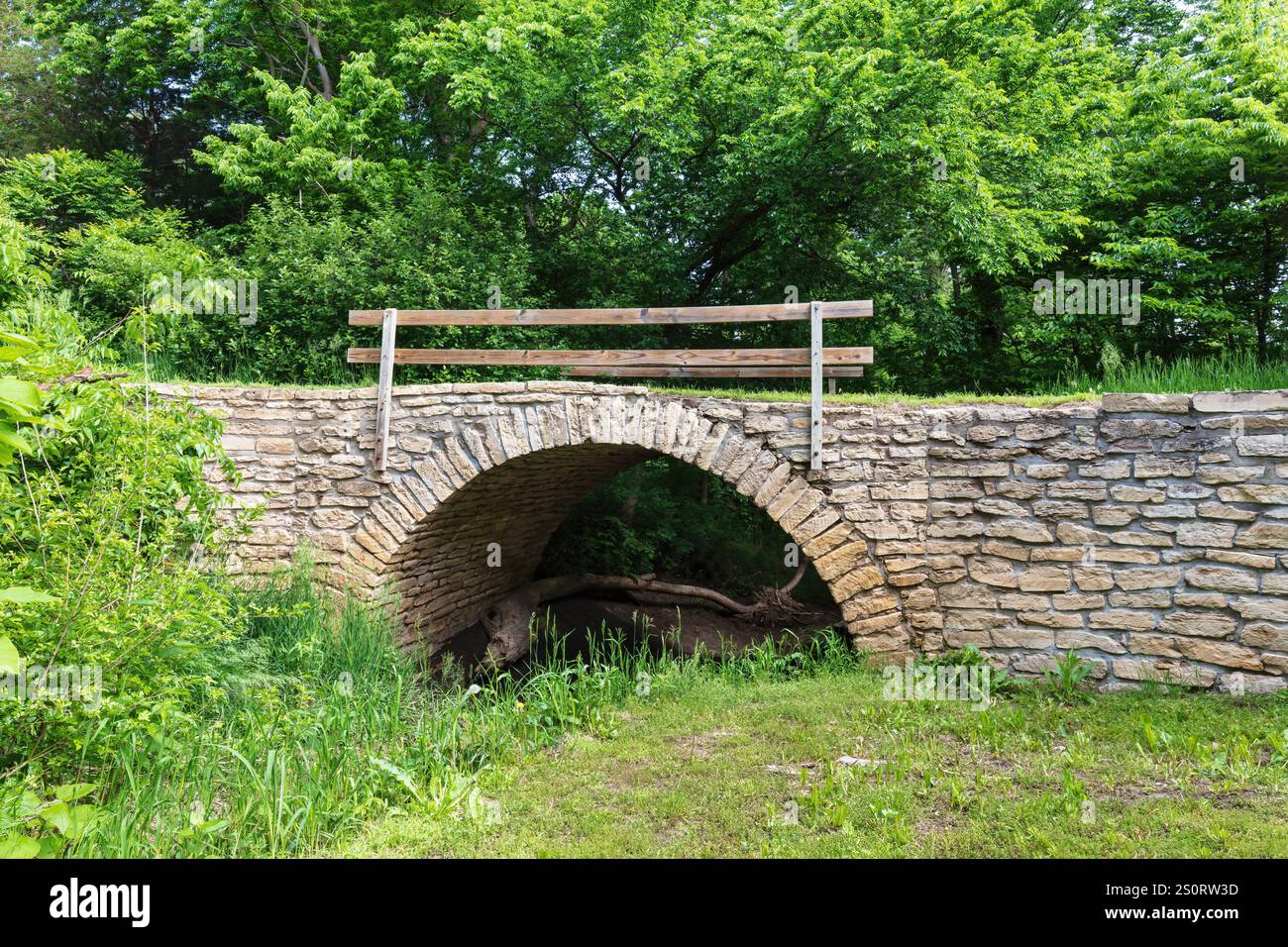 Historic limestone arch bridge built in 1899. Located in Ames, Cloud ...