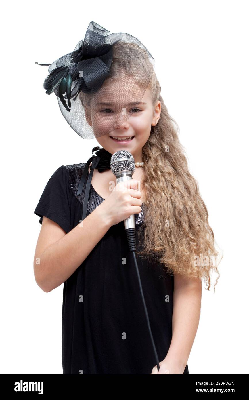Cute little girl holding microphone. White background Stock Photo - Alamy