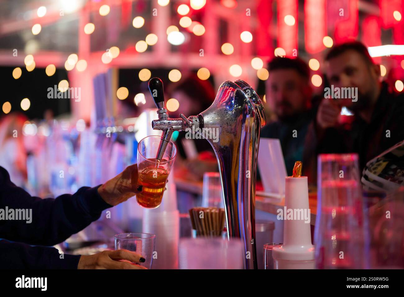 pouring draft beer into a mug in a pub Stock Photo - Alamy