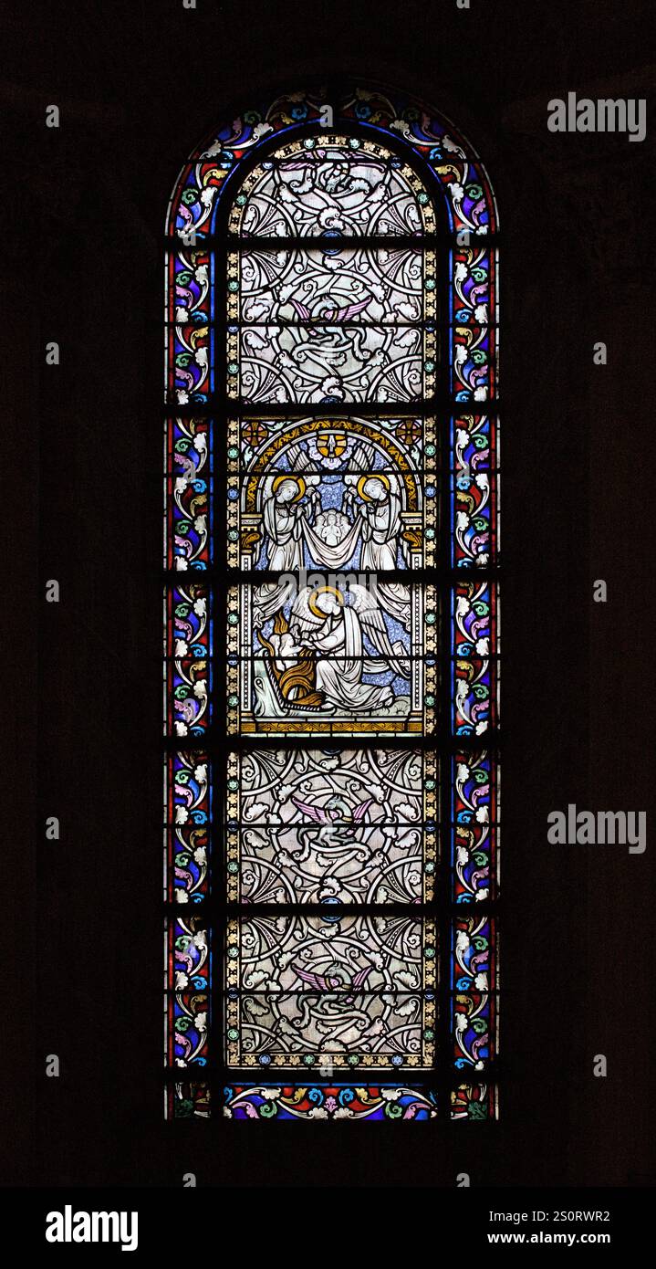 Intricate stained glass window illuminates the interior of Saint-Sernin ...