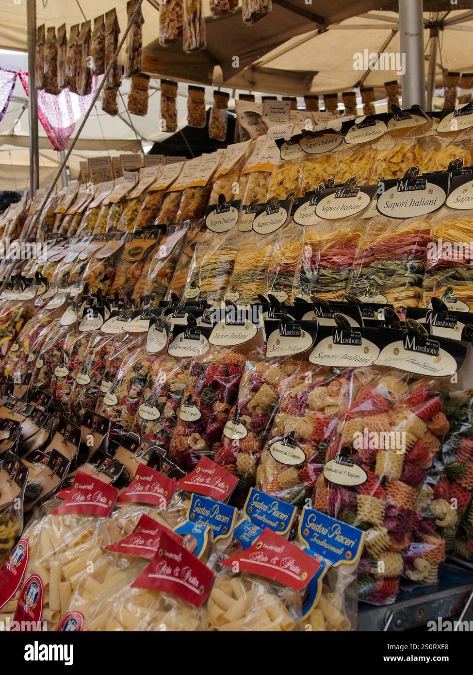 ROME, ITALY - AUGUST 01, 2015: Display of dried pasta in bags on a ...