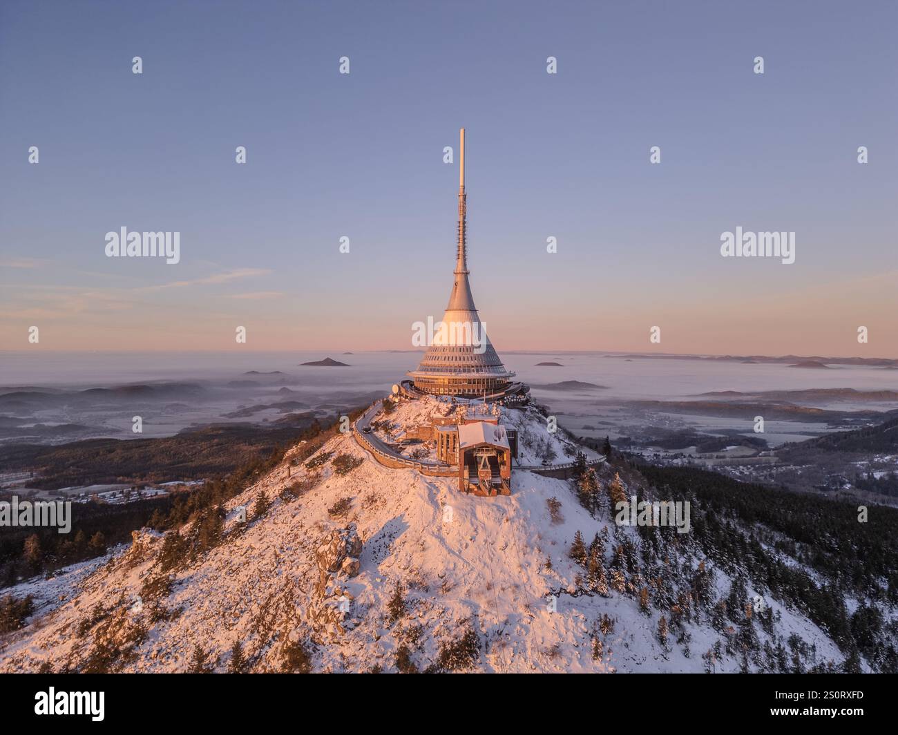 Jested Mountain showcases a breathtaking winter sunrise, illuminating ...