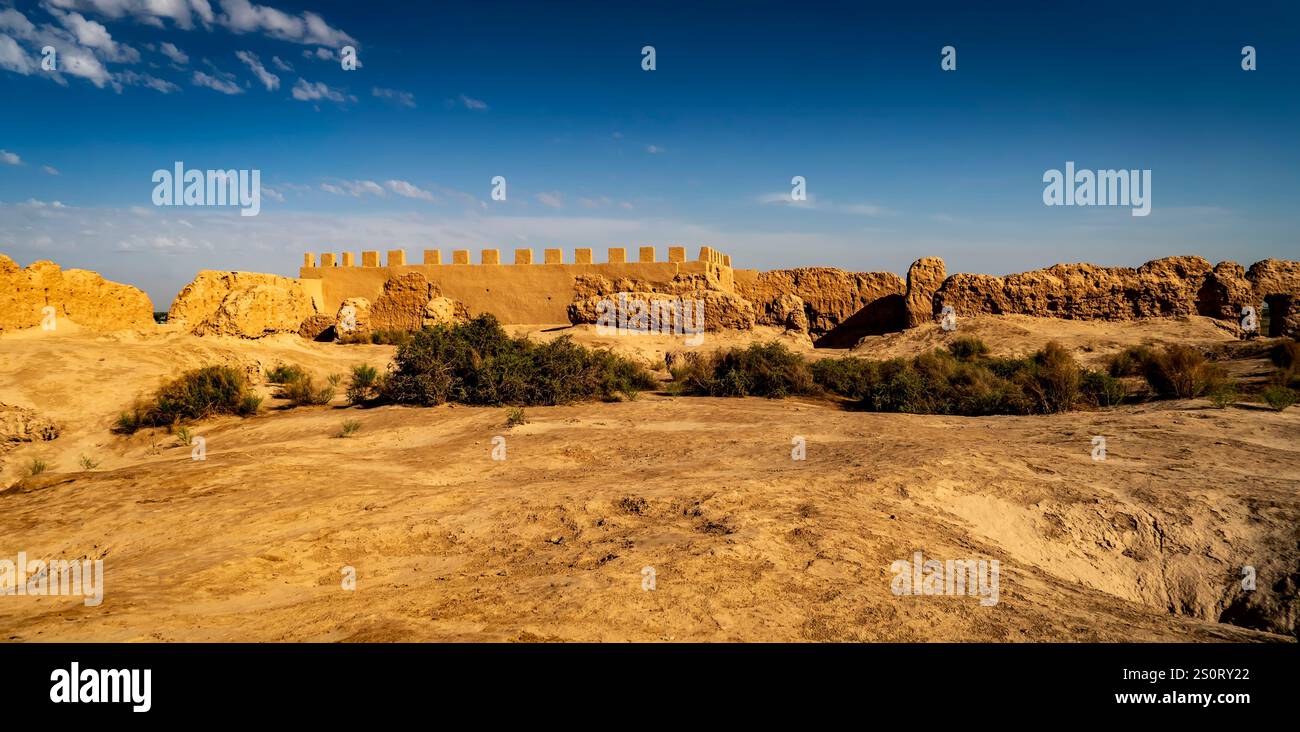 A panoramic view of ancient ruins in a desert landscape, featuring a ...