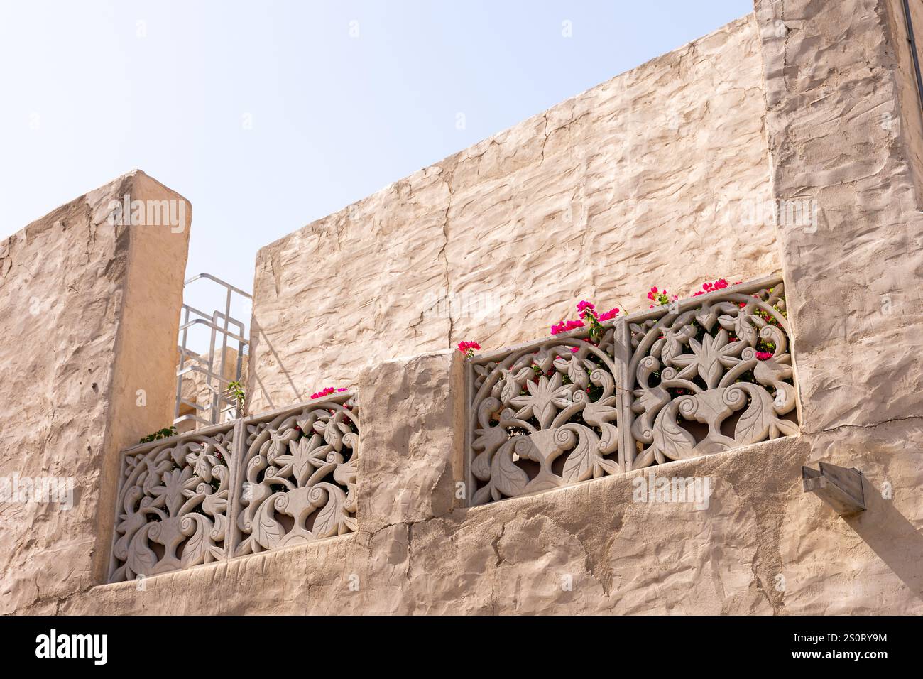 Decorative stone wall with flowers in Al Seef Dubai Creek, United Arab ...