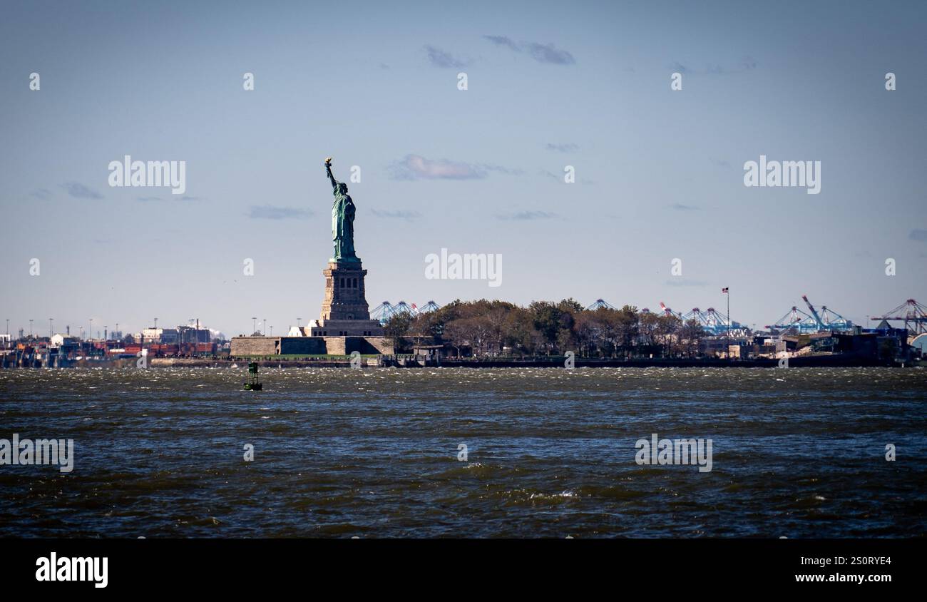 A distant view of the Statue of Liberty standing on Liberty Island ...