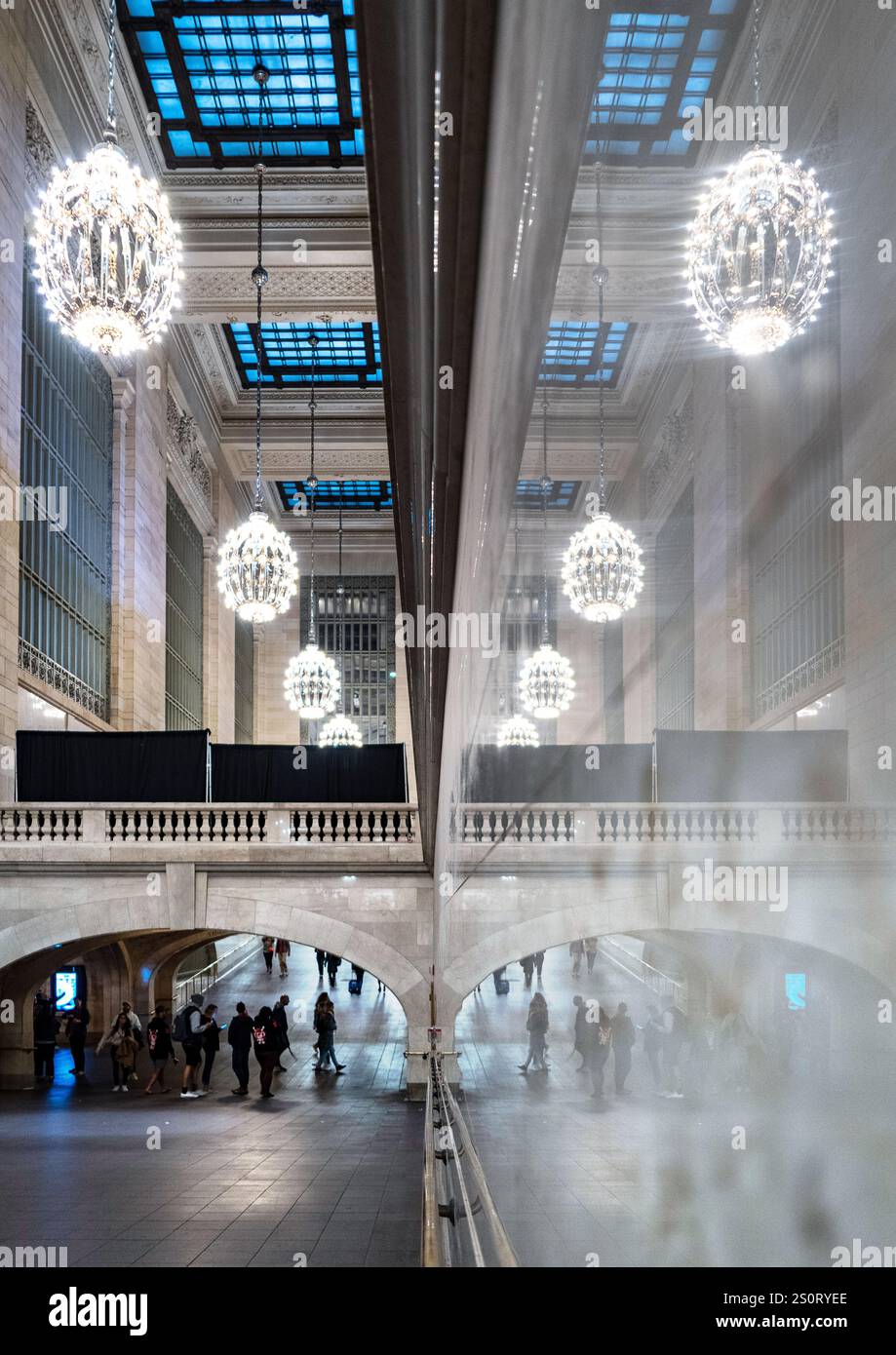 A stunning view of a grand hall featuring elegant chandeliers and a ...