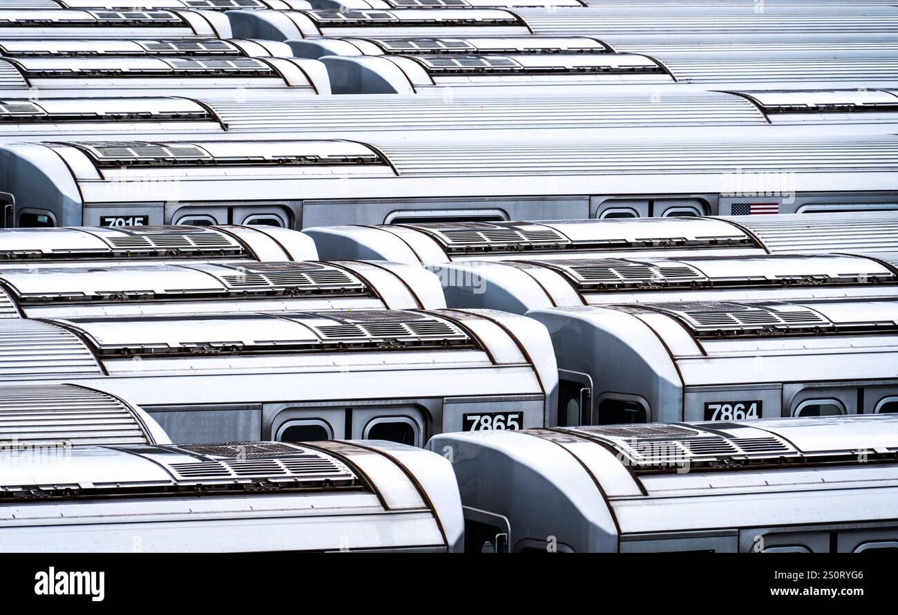 Aerial view of numerous train cars parked closely together, showcasing ...