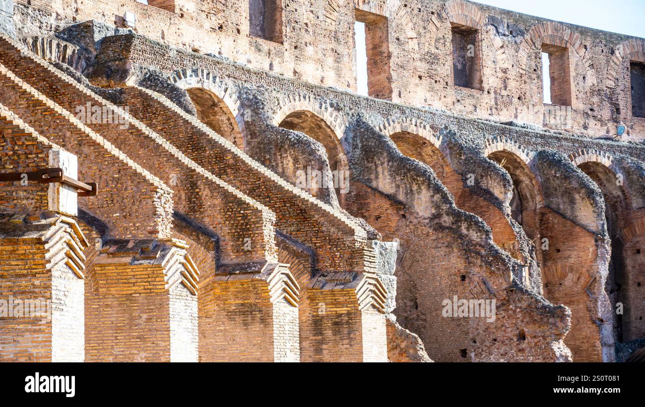 Visitors admire the intricate architecture of the Colosseum's interior ...