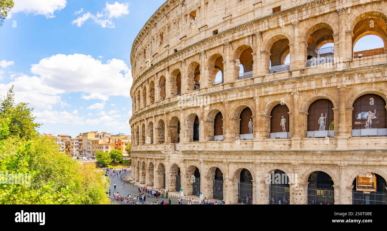 The majestic Colosseum stands prominently under a bright sky in Rome ...