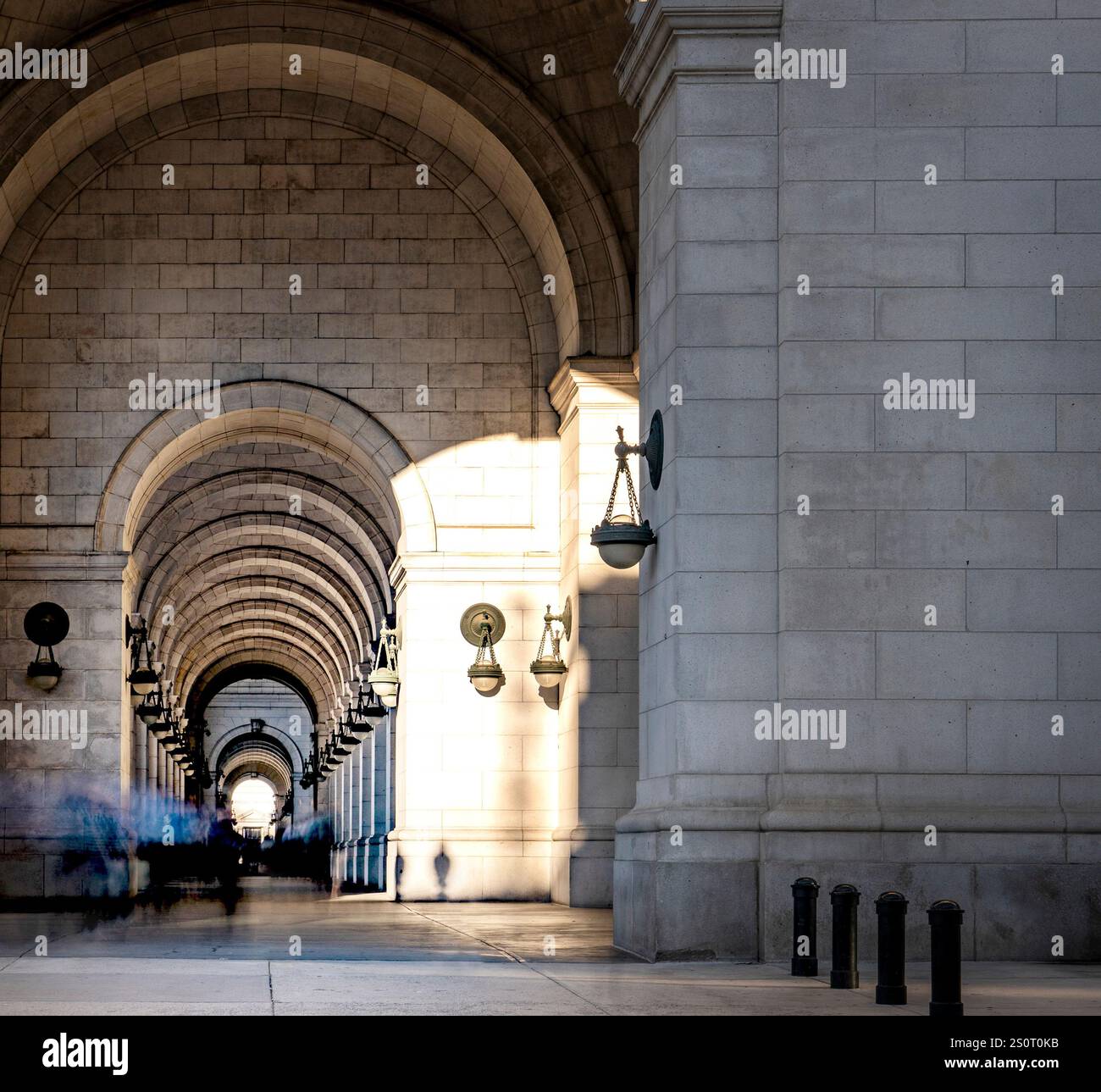 A stunning architectural view of a grand corridor with multiple arches ...