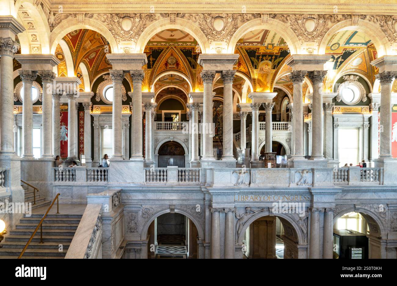 A grand interior view of a historic library featuring tall marble ...