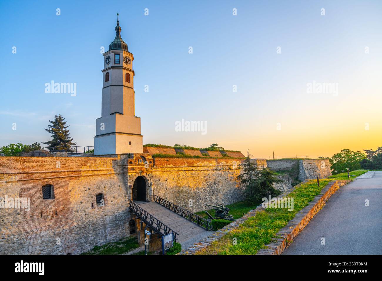 As the sun sets over Belgrade, the Clock Tower and Clock Gate at ...