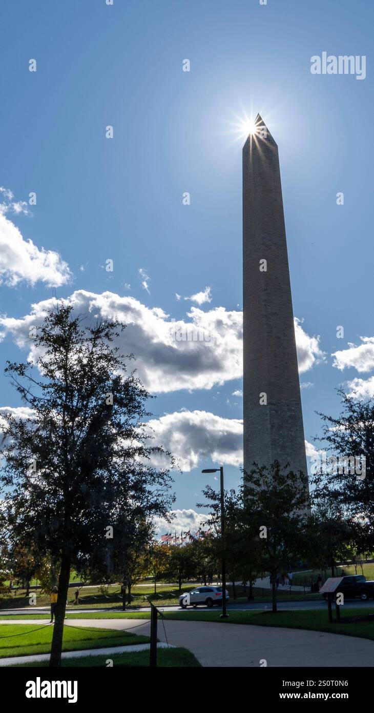 The Washington Monument stands tall against a bright blue sky with ...