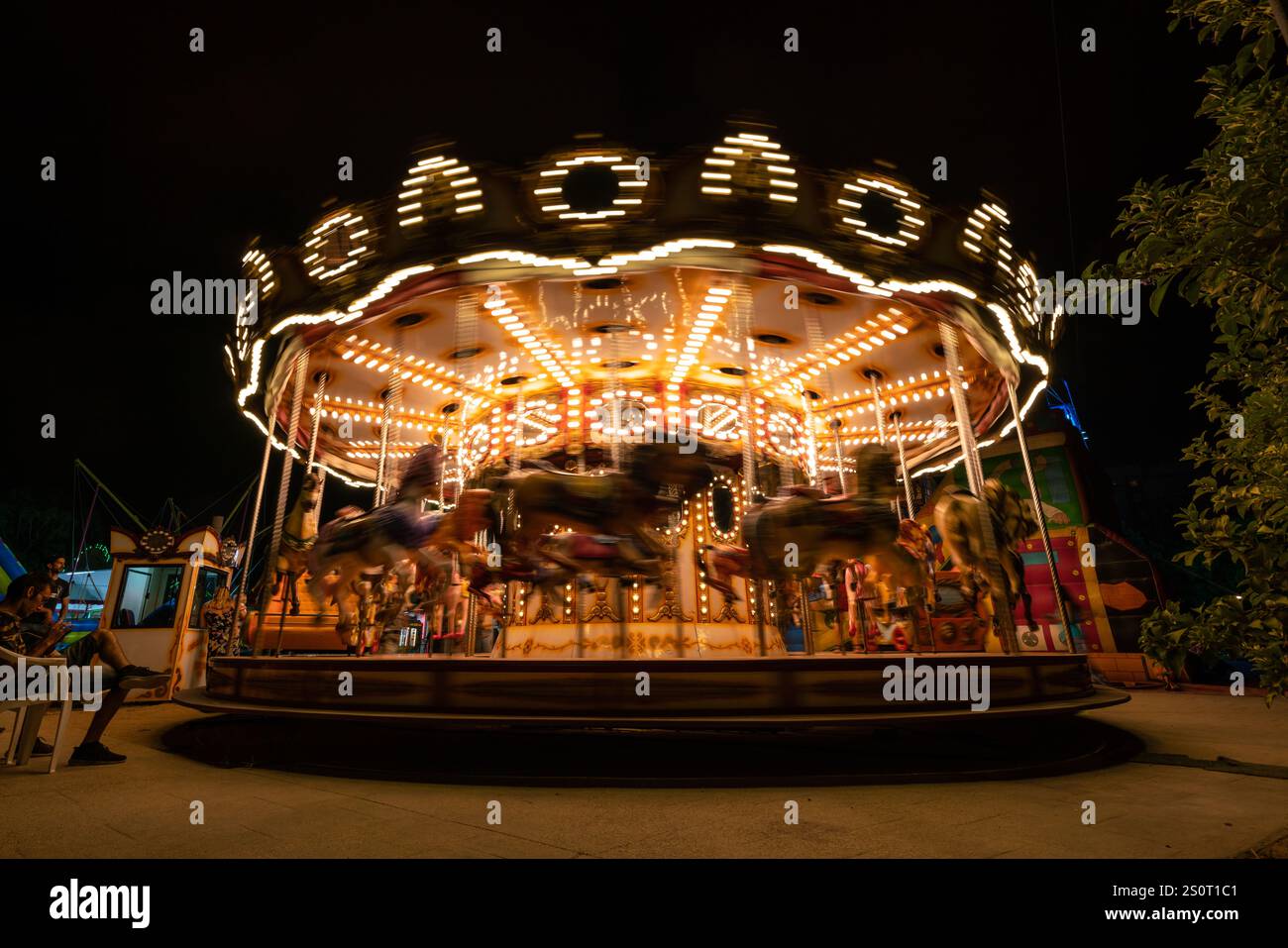 Whimsical Night Carousel at Turia Park, Valencia Stock Photo - Alamy
