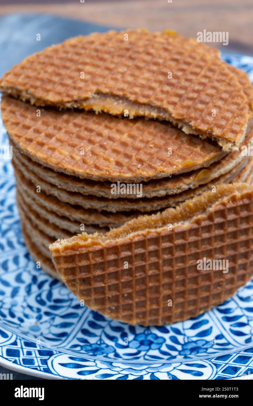 Traditional Dutch sweet dessert, pile of Butter caramel syrup waffles ...