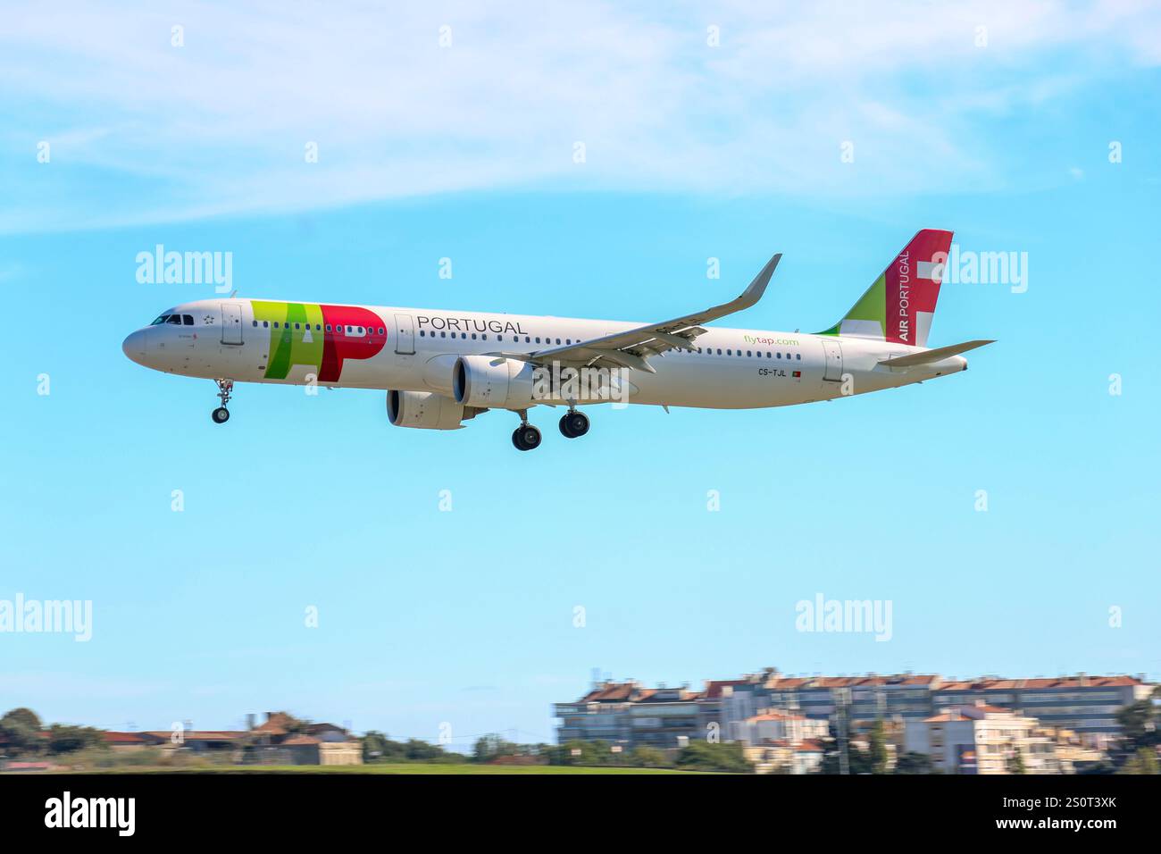 Modern passenger airplane approaching runway at lisbon humberto delgado ...