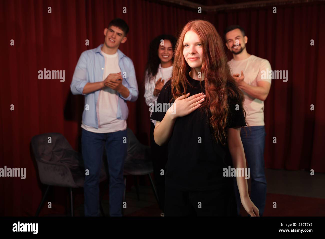 Professional actors bowing on stage in theatre Stock Photo - Alamy