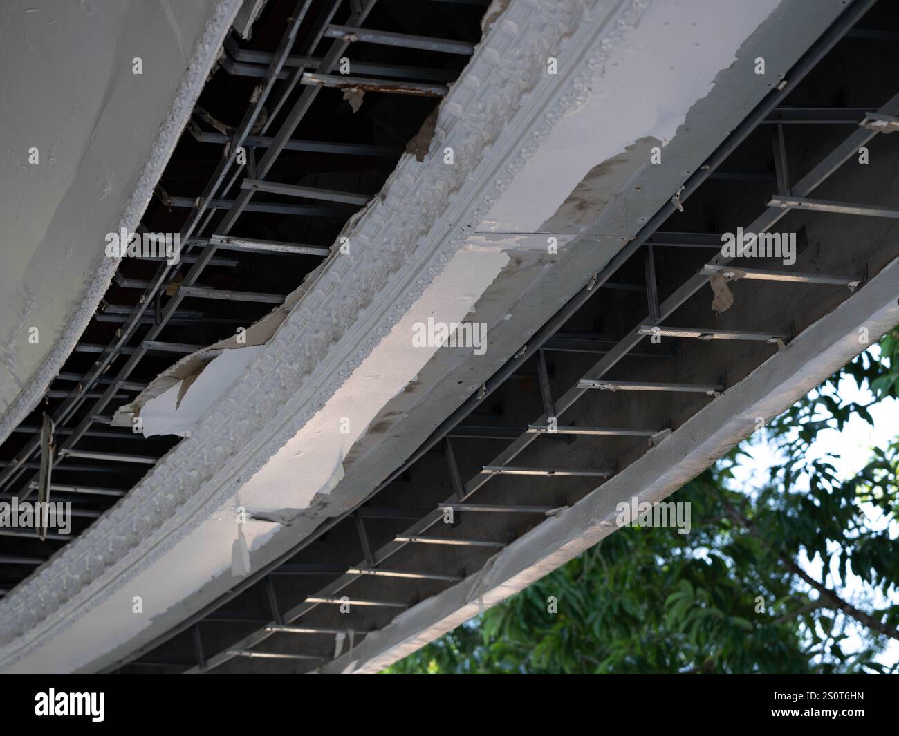 Ceiling panels damaged a large hole in the roof from rainwater leakage ...