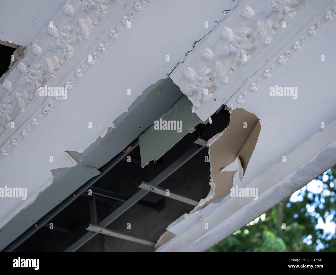 Ceiling panels damaged a large hole in the roof from rainwater leakage ...